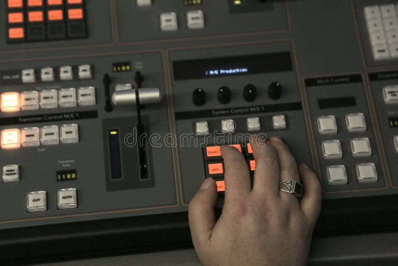 TV Editor Working with Audio Video Mixer in a Television Broadcast ...