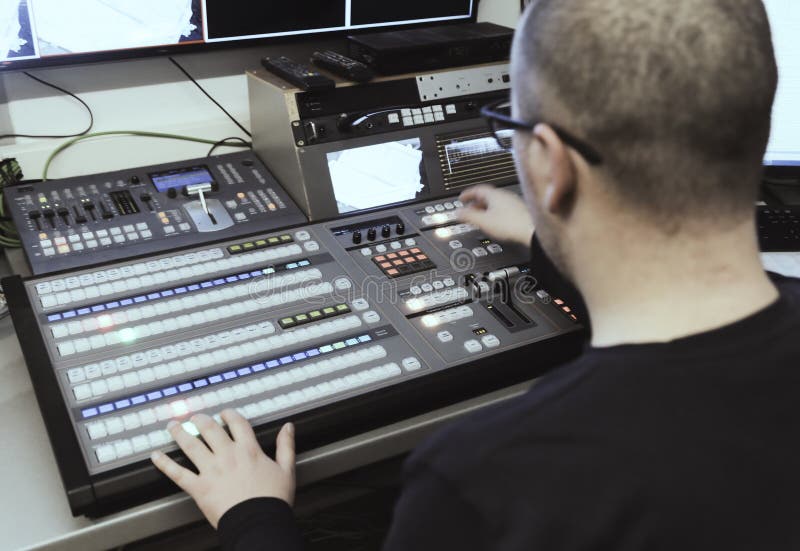 TV Editor Working with Audio Video Mixer in a Television Broadcast ...