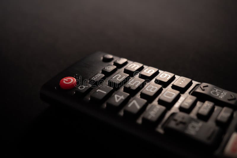 TV Power Button on the Remote Control on Black Background Stock Photo ...