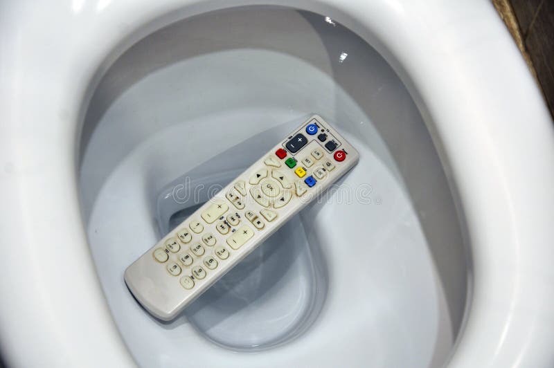 The TV Remote Accidentally Fell into the Toilet. Stock Photo - Image of ...