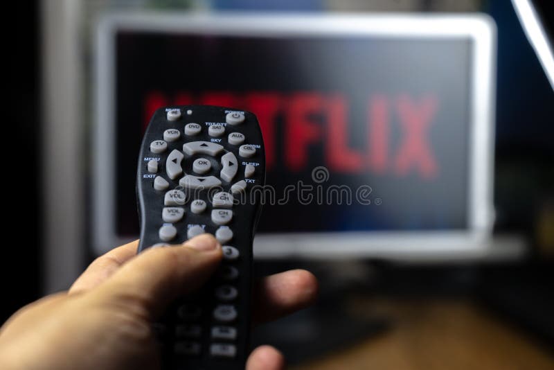 Tv Remote Control in Front of Tv Screen with Netflix Logo Editorial ...