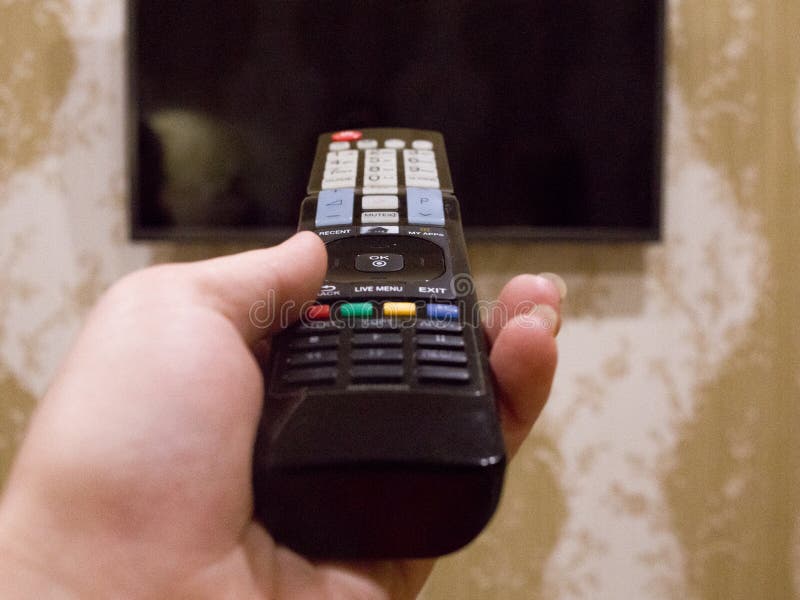 TV Remote Control in Front of the TV Stock Photo - Image of multimedia ...