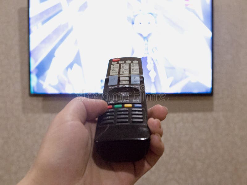 TV Remote Control in Front of the TV Editorial Stock Image - Image of ...