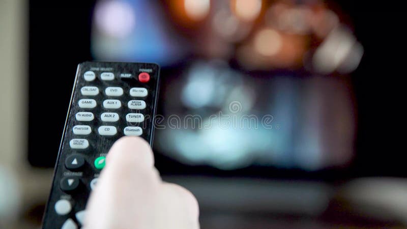 The Remote Control Switches the TV Channels and Controls the Volume ...