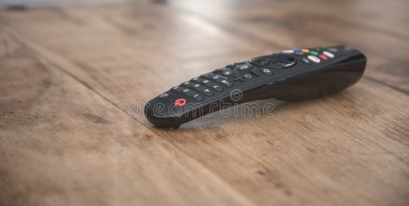 TV Remote Control on Wooden Table Stock Image - Image of eating ...