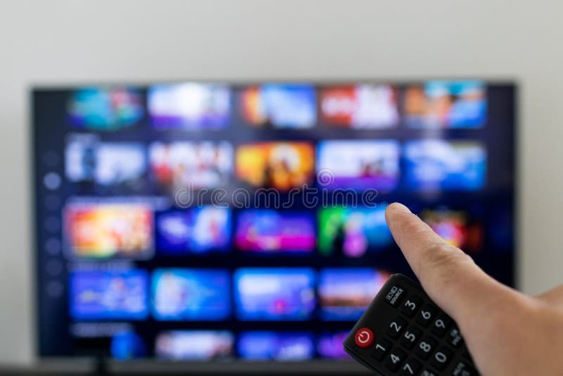 Tv Remote Controller in Hand of Customer Looking for Some Content in ...