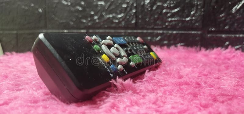 TV Remote Controller Rotating on Pink Background. Editorial Stock Photo ...