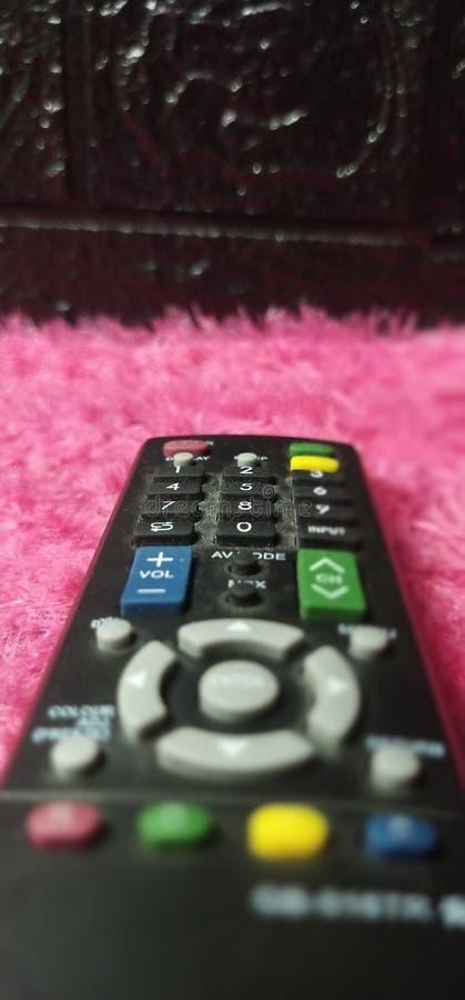 TV Remote Controller Rotating on Pink Background. Stock Photo - Image ...