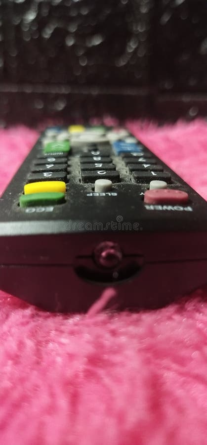 TV Remote Controller Rotating on Pink Background. Stock Photo - Image ...