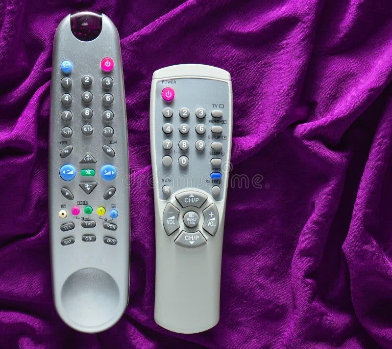 TV Remote Controls on Violet Silk Background Stock Image - Image of ...