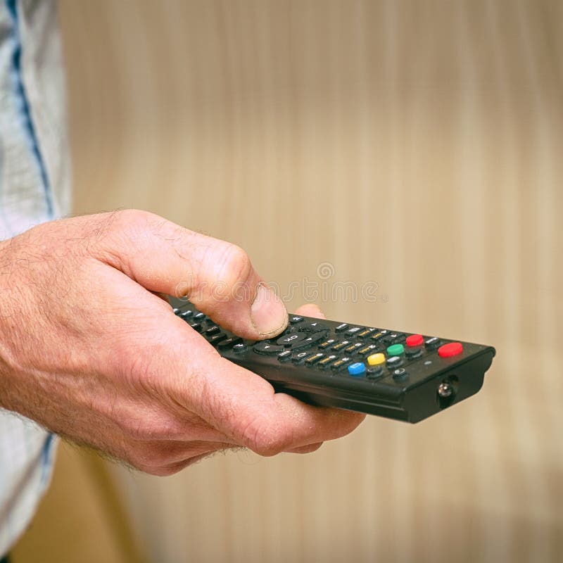 The Remote in the Hand Switch Channels on the TV Hanging on the Red ...