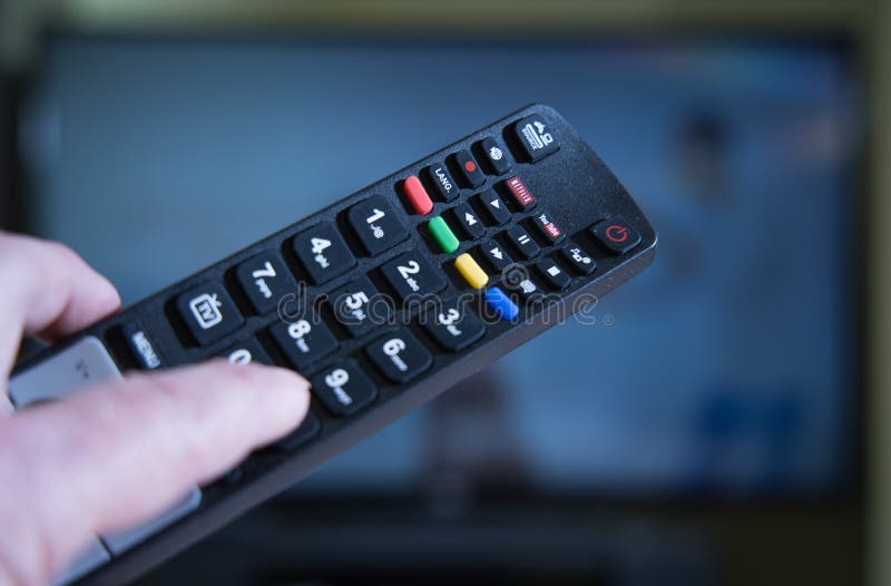 TV Remote in Use and Held by a Person Stock Photo - Image of television ...