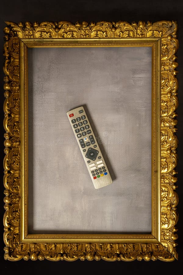 A Tv Remote with a Wooden Gilt Frame Stock Image - Image of culture ...