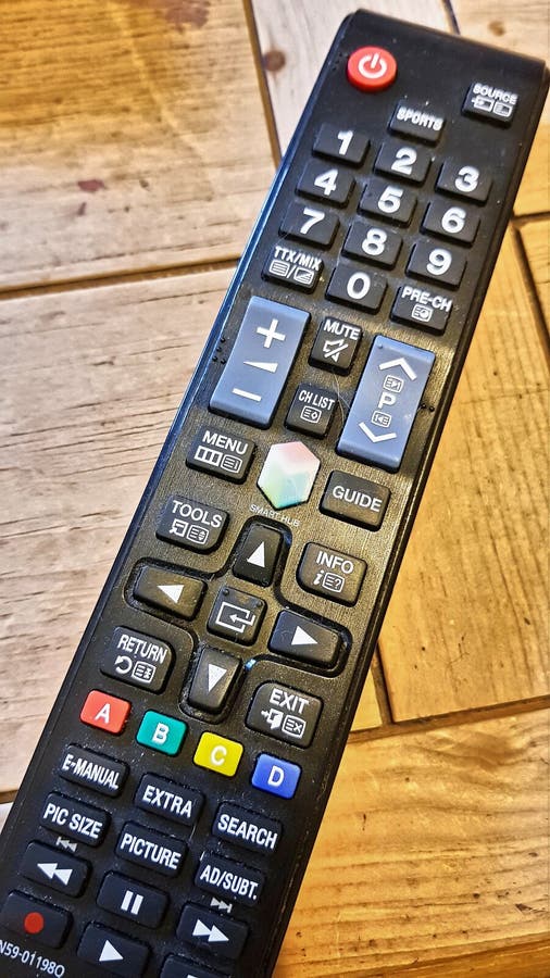 TV Remote on a Wooden Table Stock Photo - Image of remote, wooden ...