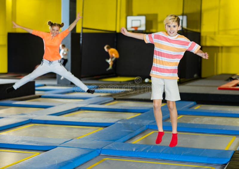 Tween Boy Jumping on Trampoline on Indoor Inflatable Playground Stock ... Tween Boy Jumping on Trampoline on Indoor Inflatable Playground Stock ...