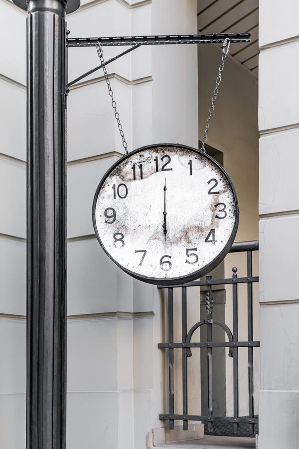 Twelve O Clock on the Dial of the Vintage Clock Against Building Facade ...