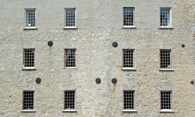 Twelve windows on old mill stock photo. Image of metal - 10667998