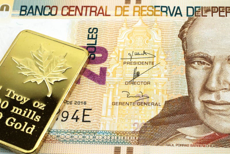 A Twenty Peruvian Soles Banknote with a Gold Bar in Macro Stock Photo ...
