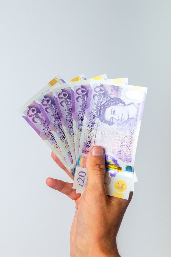 20 EUR and 20 CHF Banknotes Held in Hand Stock Photo - Image of ...