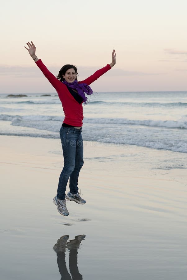 Twilight beach jump stock image. Image of beach, female - 12779223