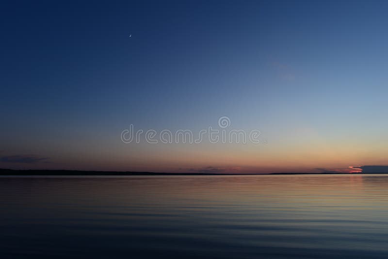 Twilight Blue Sky with a Glow Young Moon Stock Photo - Image of mystery ...