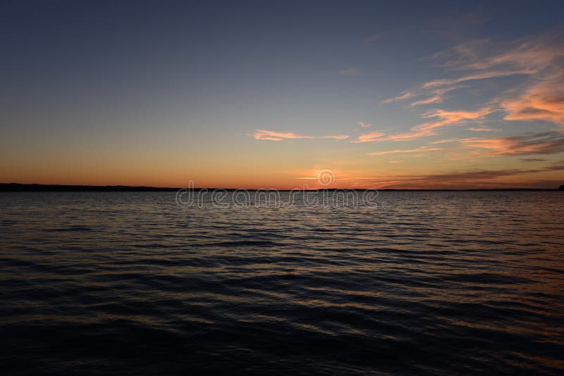 Twilight Blue Sky Over Lake Water with Wave Patterns Stock Image ...