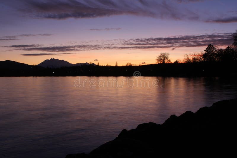 Twilight By The Lake In Cham, Zug With The Swiss Alps Stock Image ...
