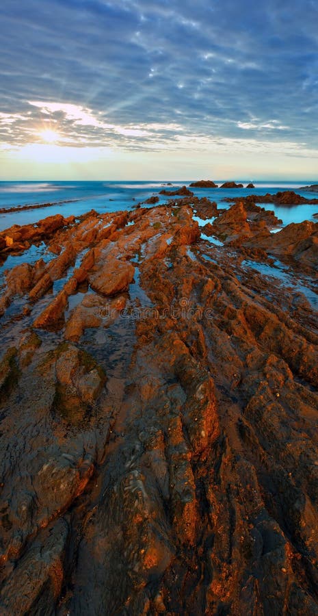 Twilight Ocean Coast with Ribbed Stratiform Rock Stock Image - Image of ...