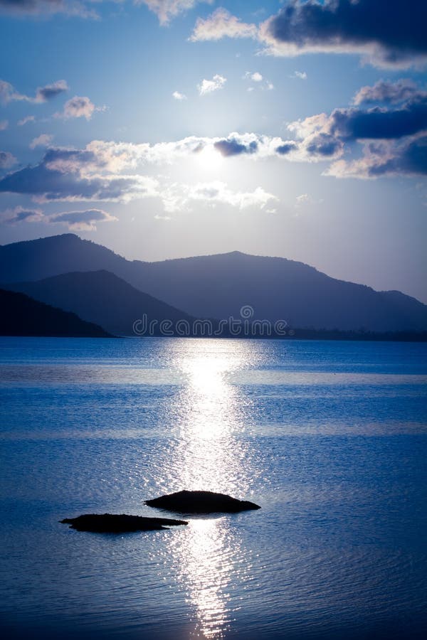 Twilight Over a Rocky Coast and Mountains in the Stock Image - Image of ...