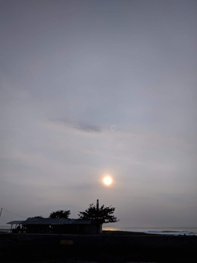 The Twilight Sun As the Sun Sets Over a Very Beautiful Tree Stock Image ...