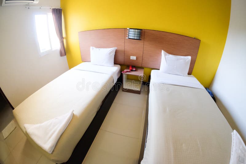 Twin beds in hotel room stock photo. Image of elegance - 84161836