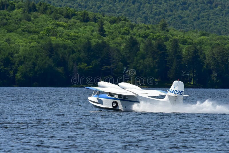 Twin Engine Seaplane Taking Off Editorial Photo - Image of trees, speed ...