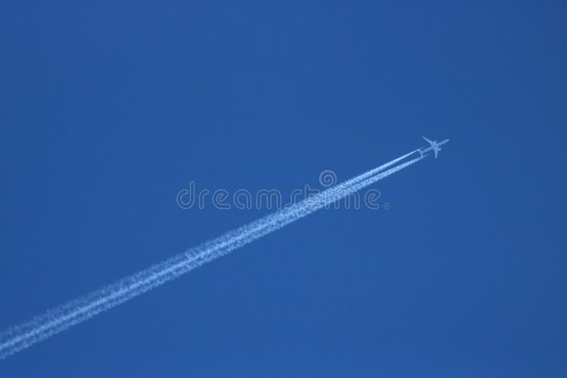 Twin Engined Jet Plane with Contrail in Blue Sky Stock Photo - Image of ...