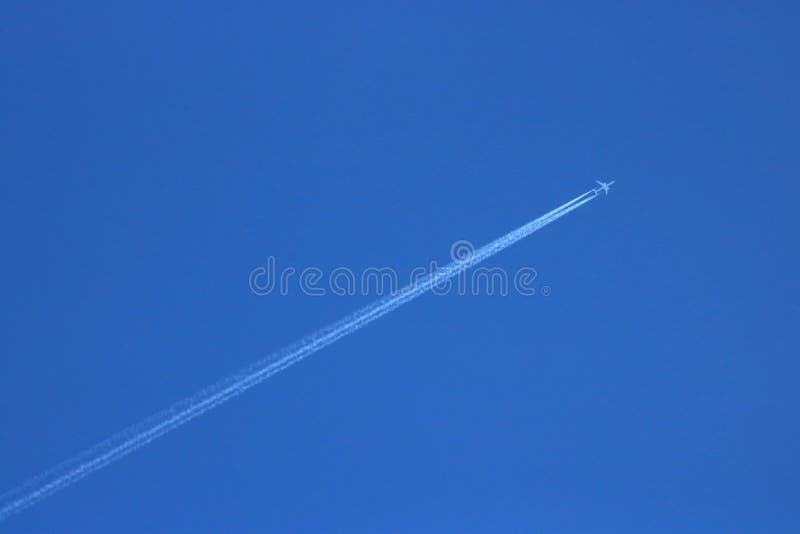 Twin Engined Jet Plane with Contrail in Blue Sky Stock Photo - Image of ...