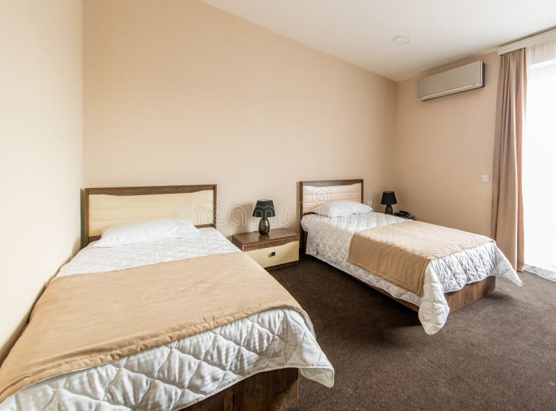 Twin room in modern hotel stock photo. Image of light - 271154414