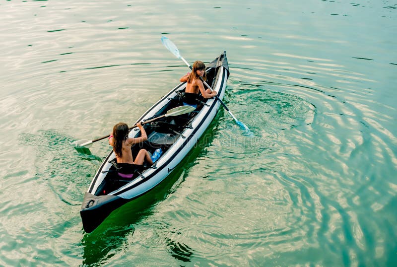 Twin Sisters in a Canoe on the River in Ada Bojana, Montenegro Stock ...