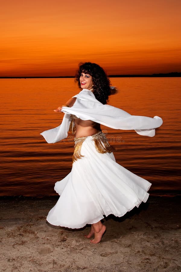 Twirling Bellydancer at Sunset Stock Photo - Image of twenties ...