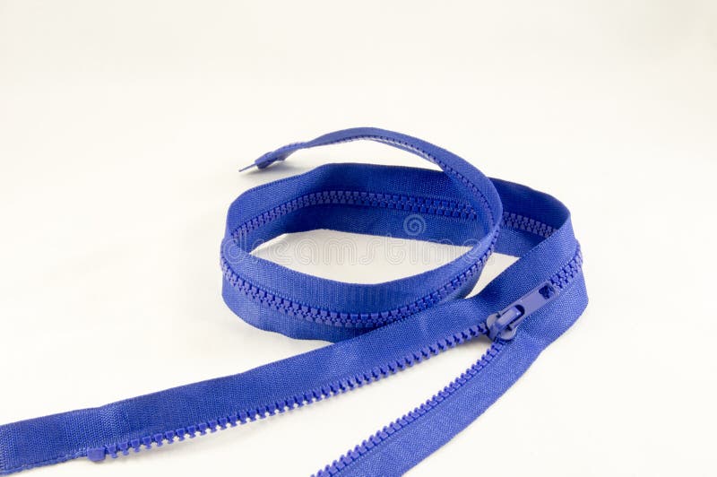 Twisted Blue Zipper on a Light Cloth Stock Photo - Image of cloth ...