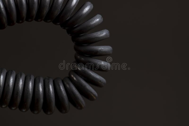 A Twisted Cable Close Up, an Old Black Cable in a Stock Photo - Image ...