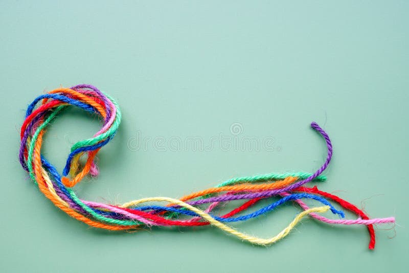 Twisted Multicolored Threads Forming a Rope. Unity and Teamwork. Stock ...