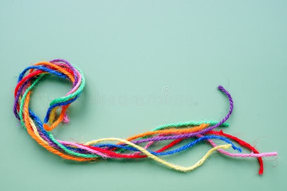 Twisted Multicolored Threads Forming a Rope. Unity and Teamwork. Stock ...