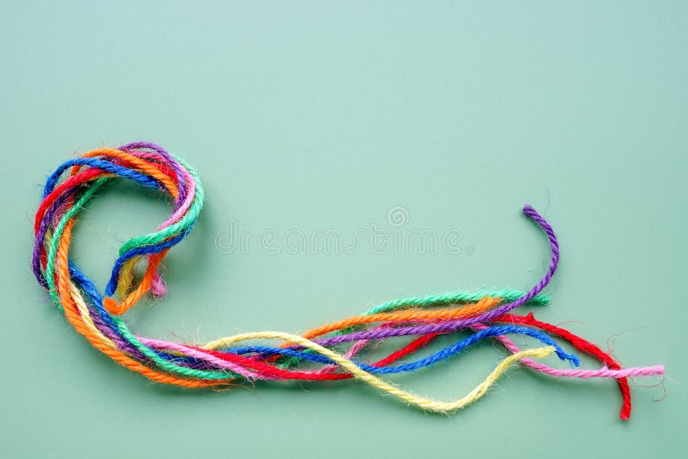 Twisted Multicolored Threads Forming a Rope. Unity and Teamwork. Stock ...