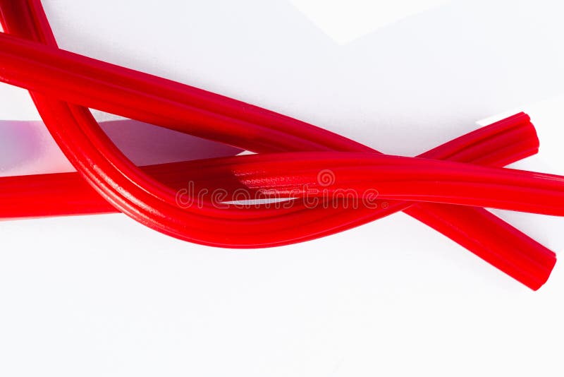 Twisted Red Licorice Sticks on White Background, Copy Space Stock Image ...