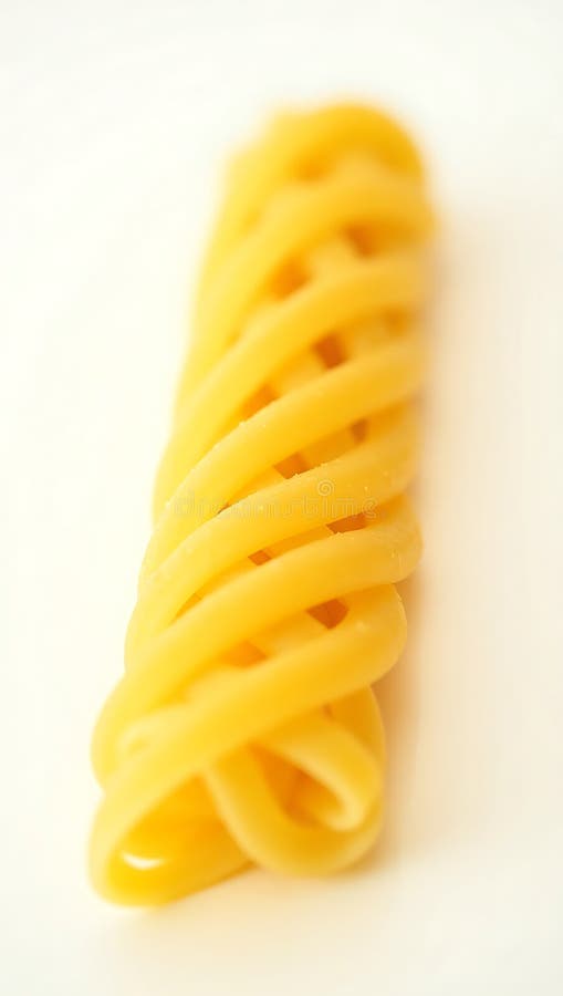 Twisted Strands of Fresh Pasta Captured in Extreme Closeup on Clean ...