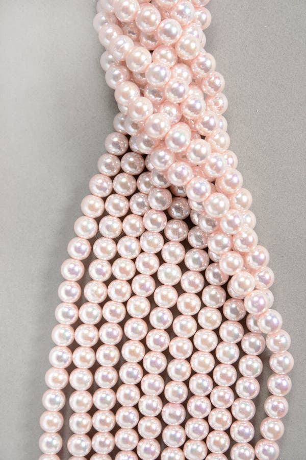 Twisted Strands of Pink Pearls Stock Image - Image of gray, pearls ...