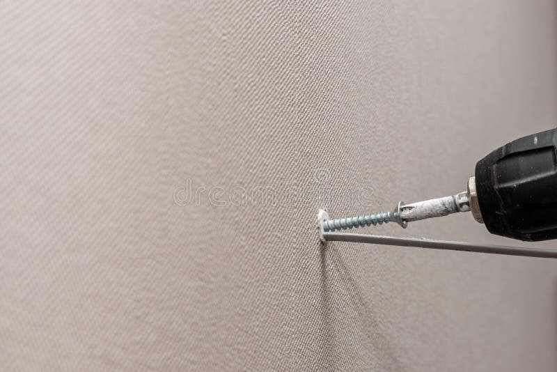 Twisting the into the Wall with a Screwdriver Stock Image - Image of ...