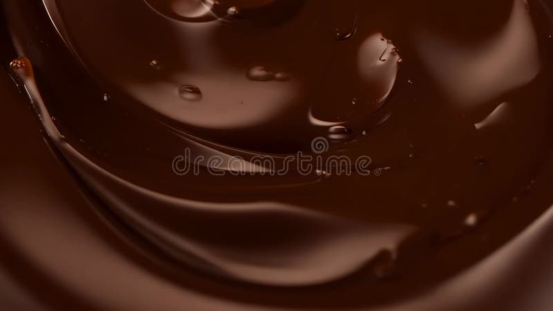 Twisting Stream of Melted Chocolate in Motion, Creating Smooth Curves ...