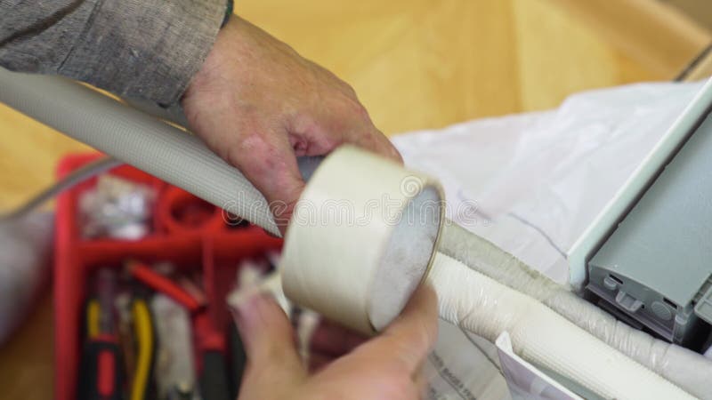 Twisting the Tubes and Wire the Route of the Split System with Adhesive ...