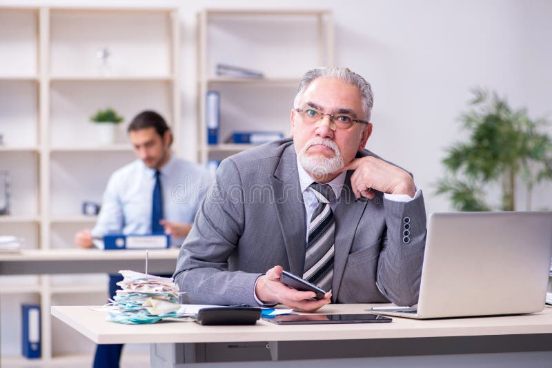 Two Accountants Working in the Office Stock Photo - Image of pile ...