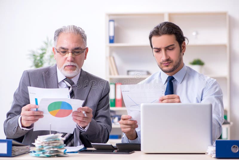 Two Accountants Working in the Office Stock Photo - Image of graph ...